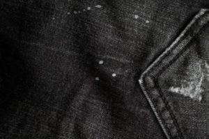 What Causes White Streaks on Black Jeans?